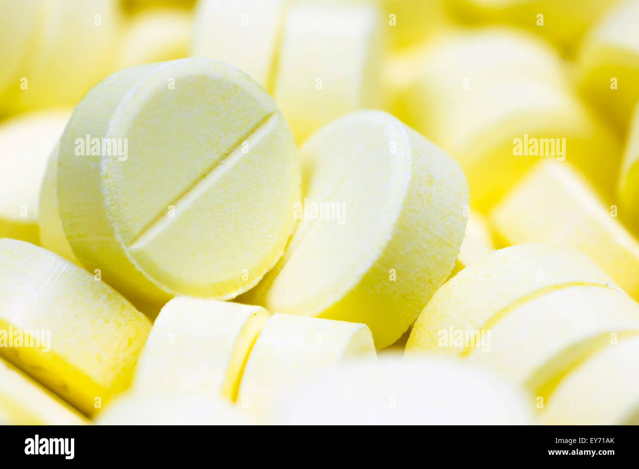 Pharmacy theme, Heap of yellow round medicine tablet antibiotic pills ...