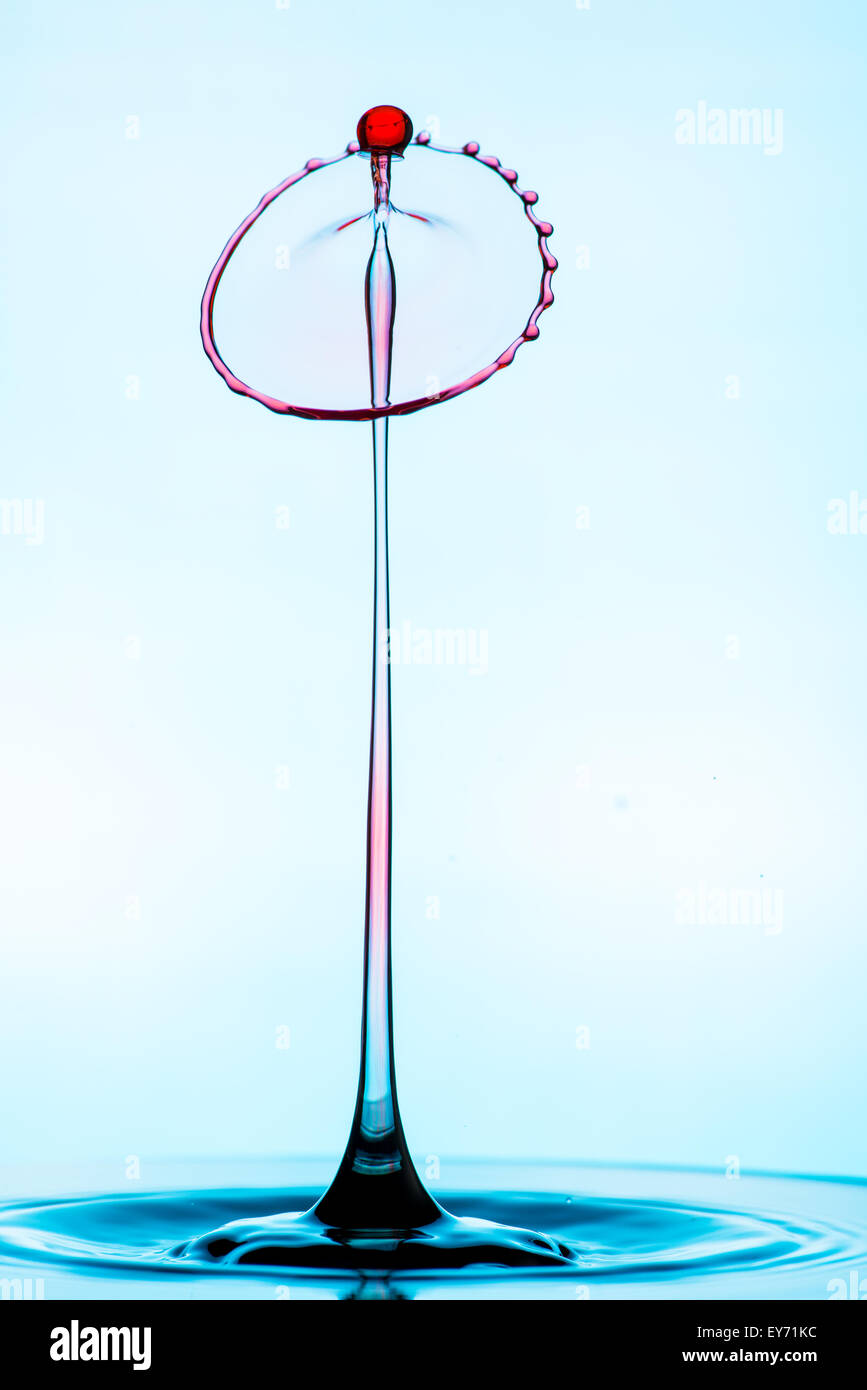 Collision of water drops. High speed flash photography capturing water ...