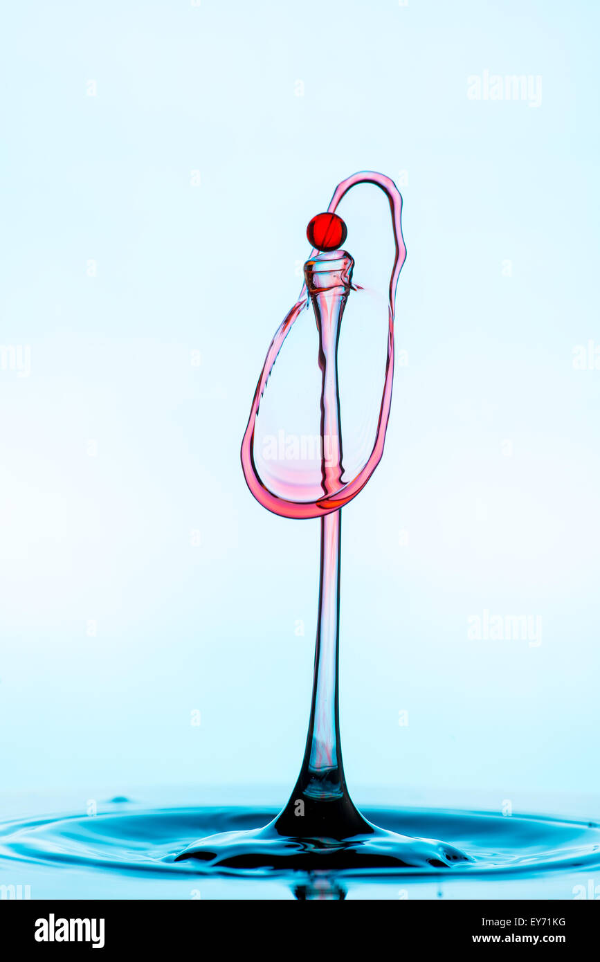 Collision of water drops. High speed flash photography capturing water ...