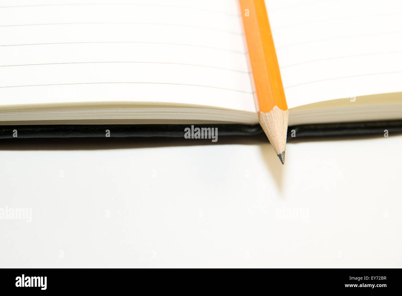 Notepad with a recording sheet and pencil on a white background Stock ...