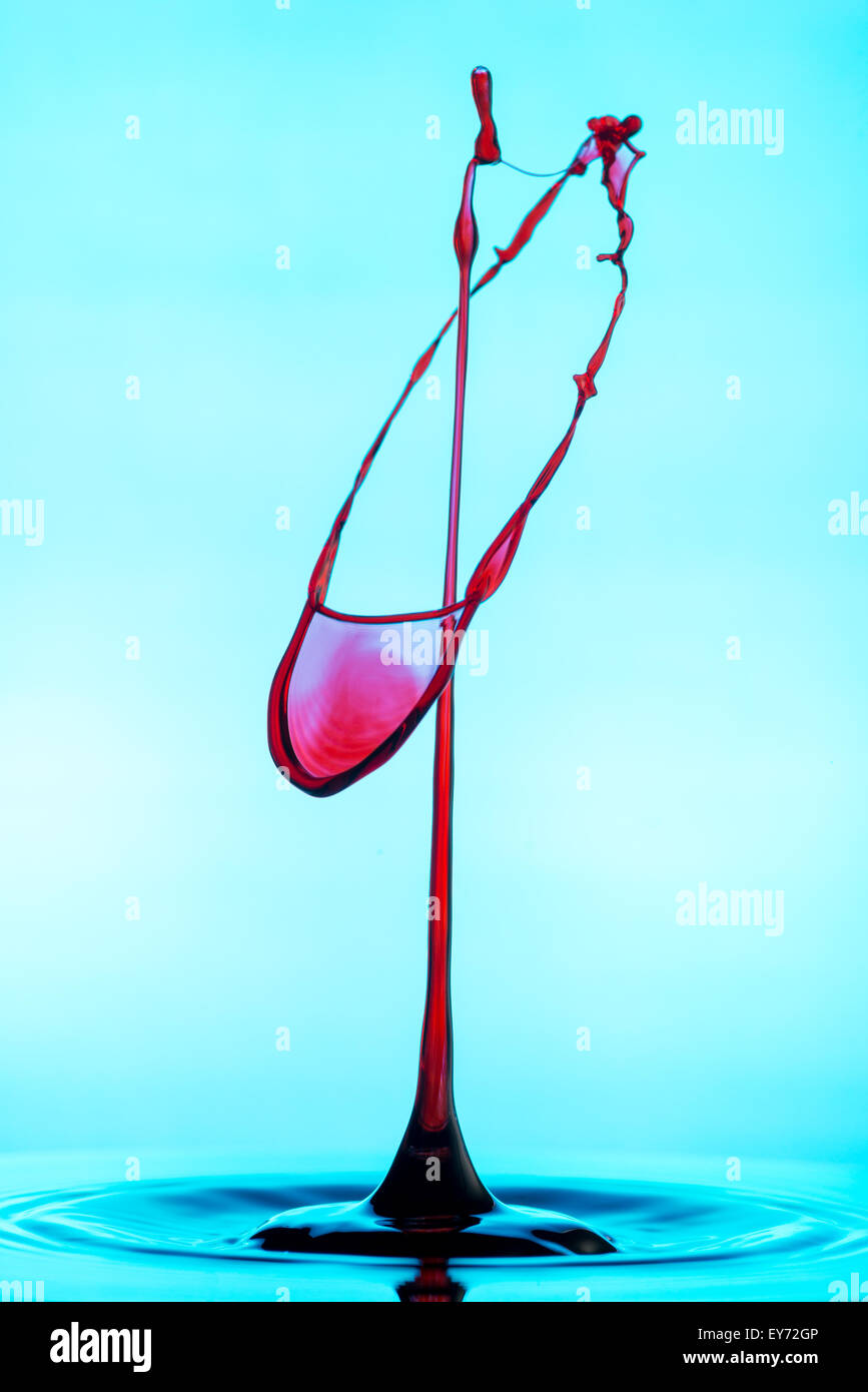 Collision of water drops. High speed flash photography capturing water ...