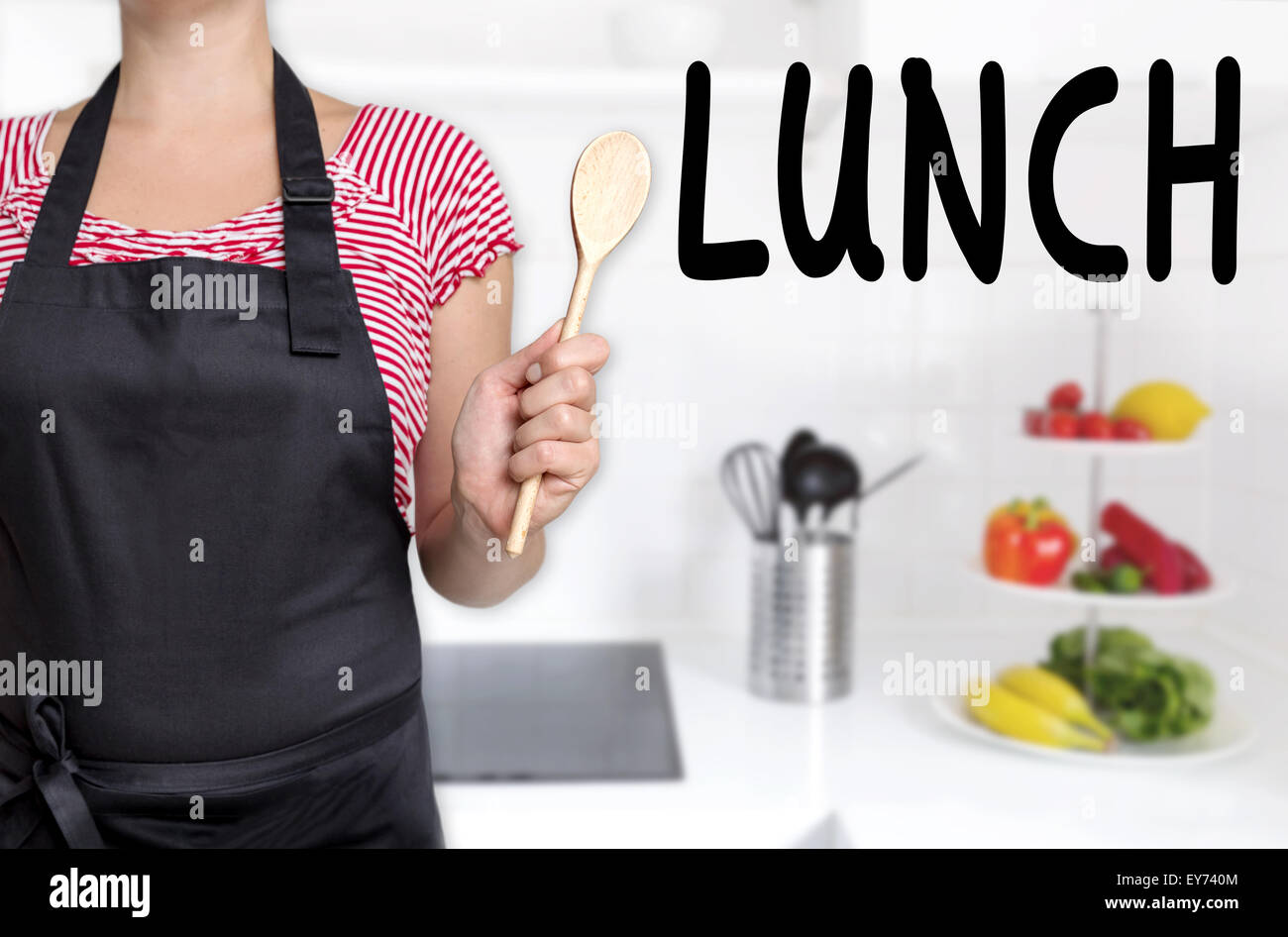 Lunch cook holding wooden spoon background Stock Photo - Alamy
