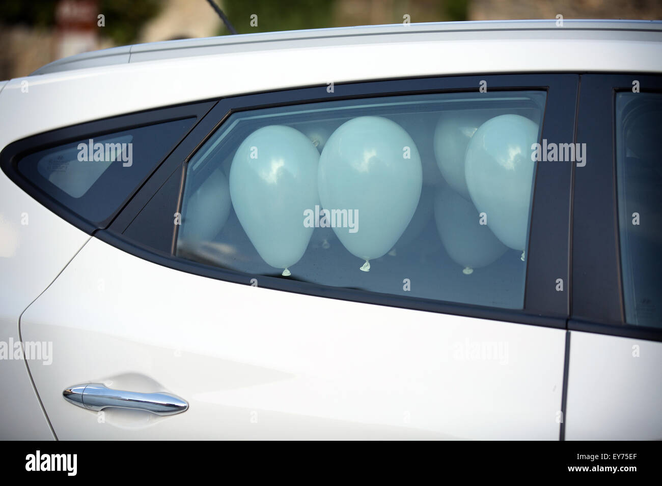 White Balloons on a Car in a Wedding Day Stock Photo - Alamy