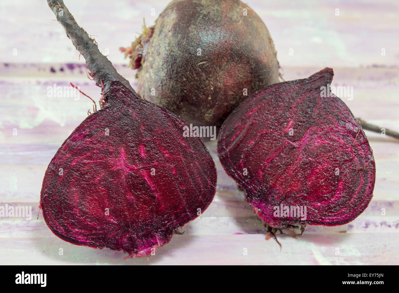 Whole and sliced beetroot on the wooden table Stock Photo - Alamy