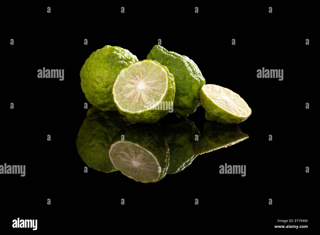 Ripe bergamot fruit on black background. Culinary cooking ingredient ...