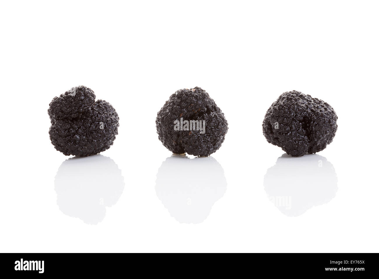 Three truffle isolated on white. Luxurious culinary cooking ingredients ...