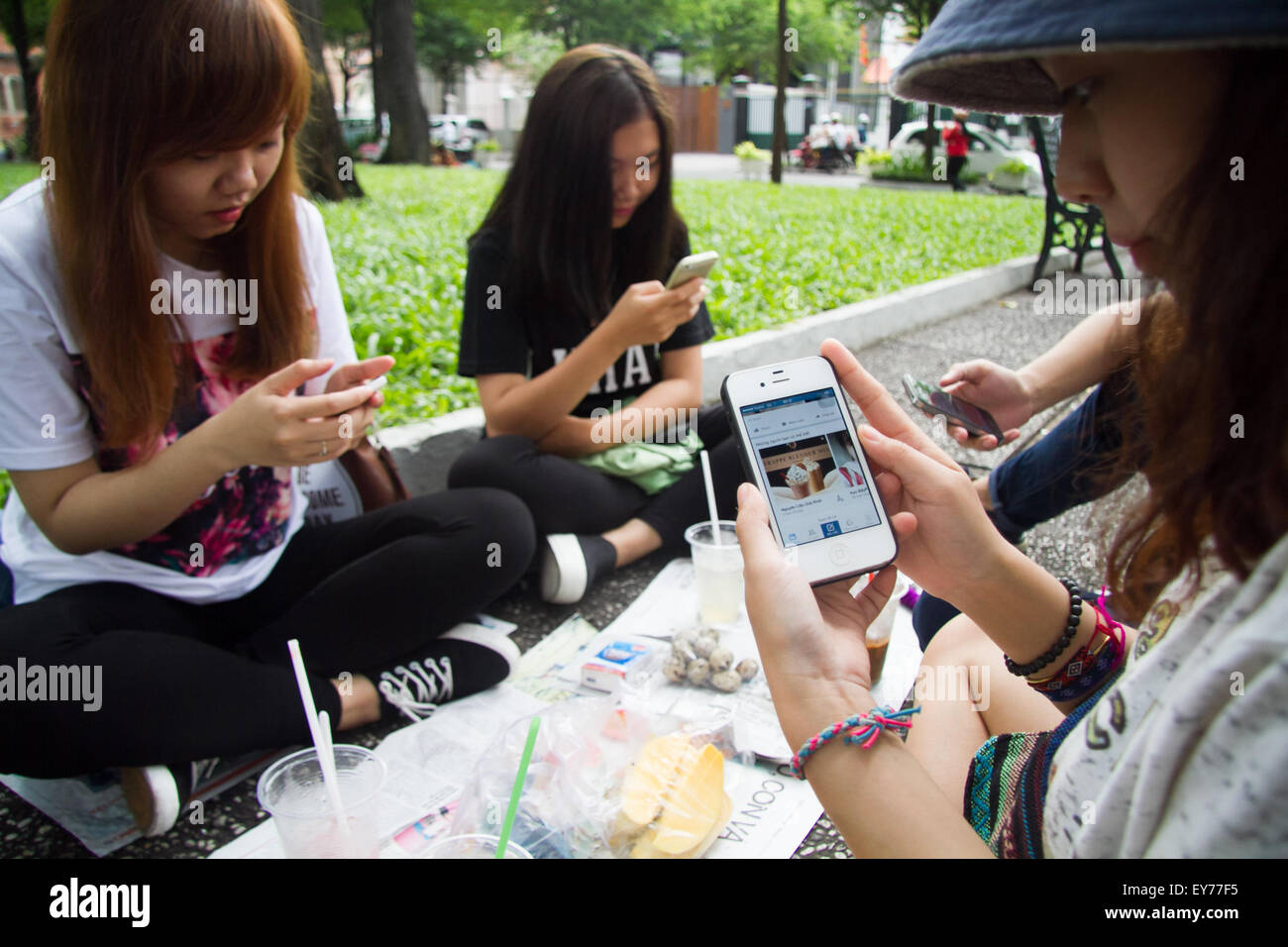 Ho Chi Minh City, Vietnam. 23rd July, 2015. Vietnamese youths use ...