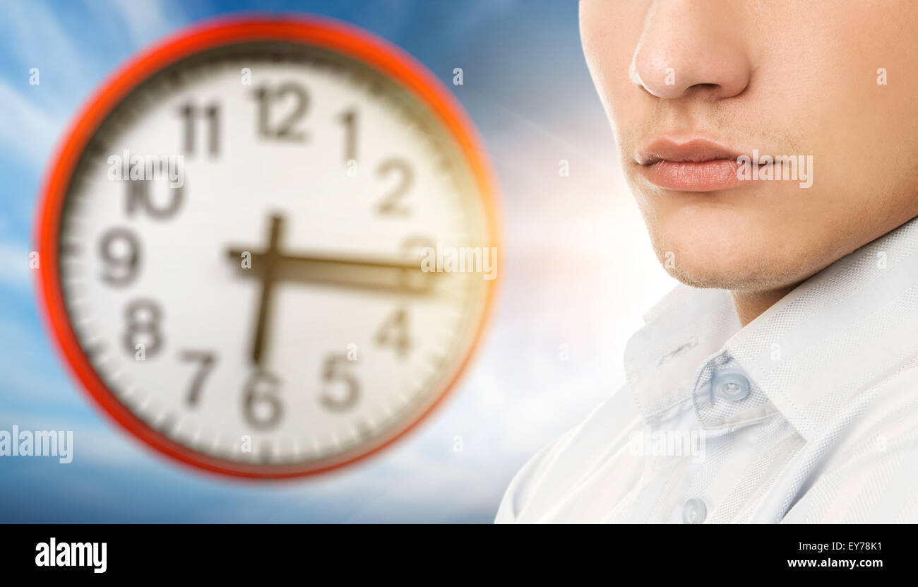 Business man's face and clock Stock Photo - Alamy
