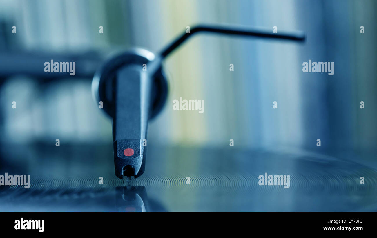 Dj needle stylus on spinning record, vinyl background Stock Photo - Alamy