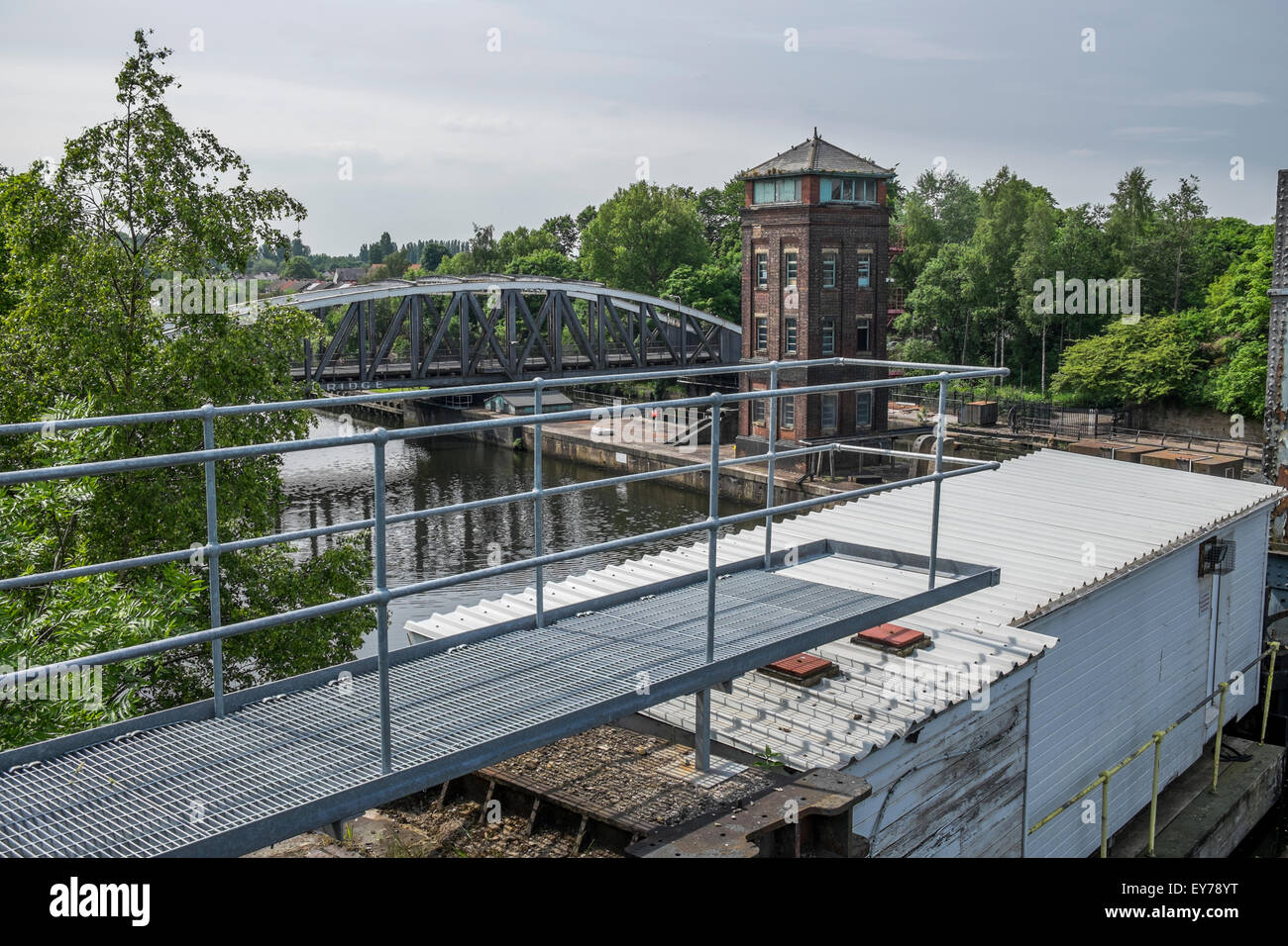 Small platform leading out over the Manchester Canal with swing bridge ...