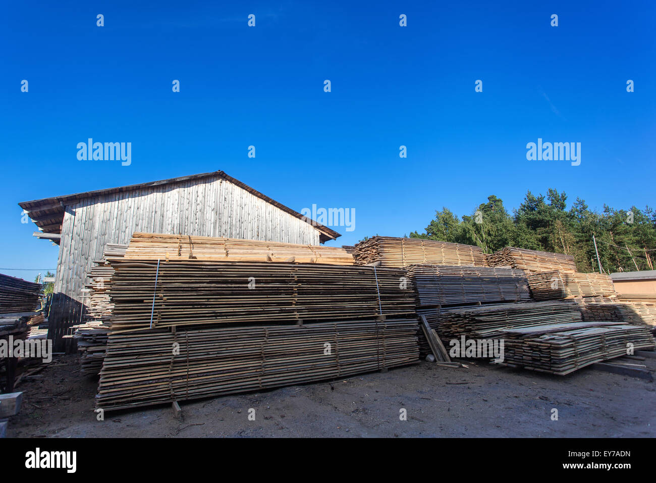 Saw mill with stack of wood Stock Photo - Alamy