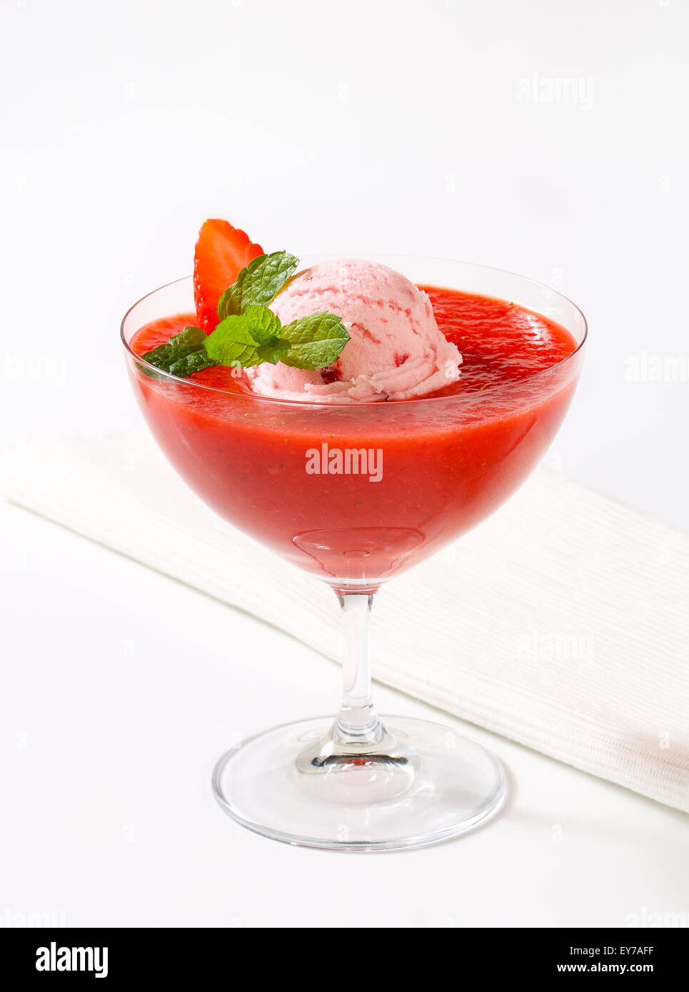Ice cream with strawberry puree in stemmed glass Stock Photo - Alamy
