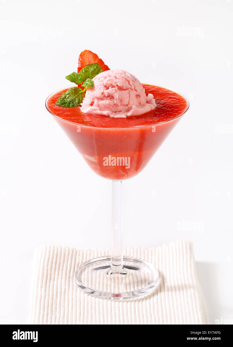 Ice cream with strawberry puree in cocktail glass Stock Photo - Alamy
