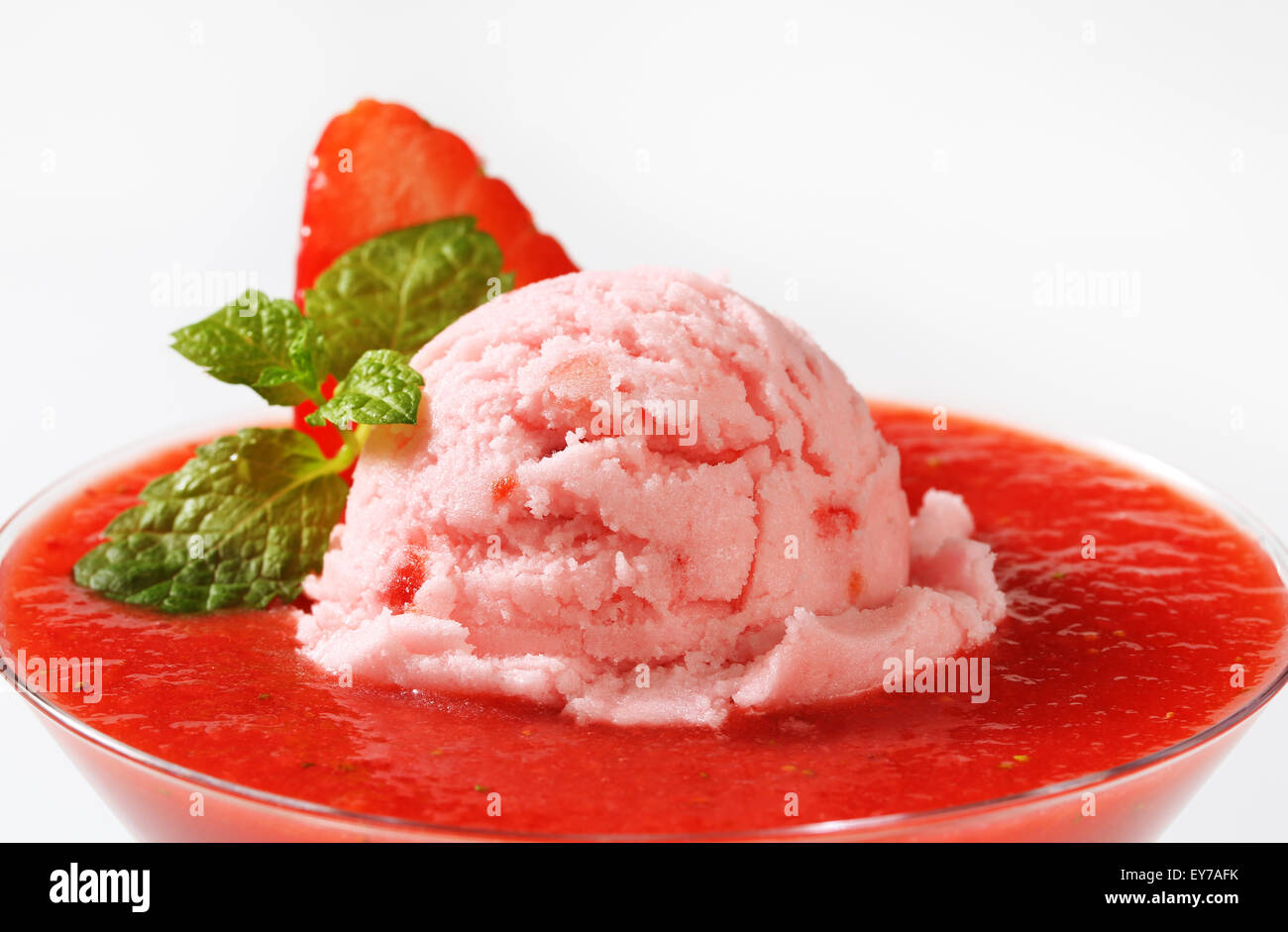 Ice cream with strawberry puree in cocktail glass Stock Photo - Alamy