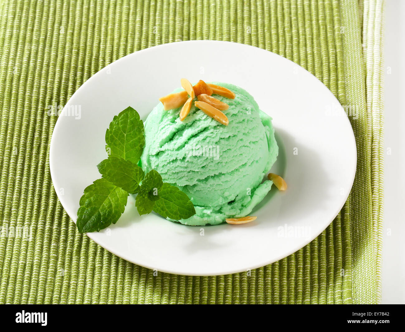 Scoop of green ice cream on plate Stock Photo - Alamy