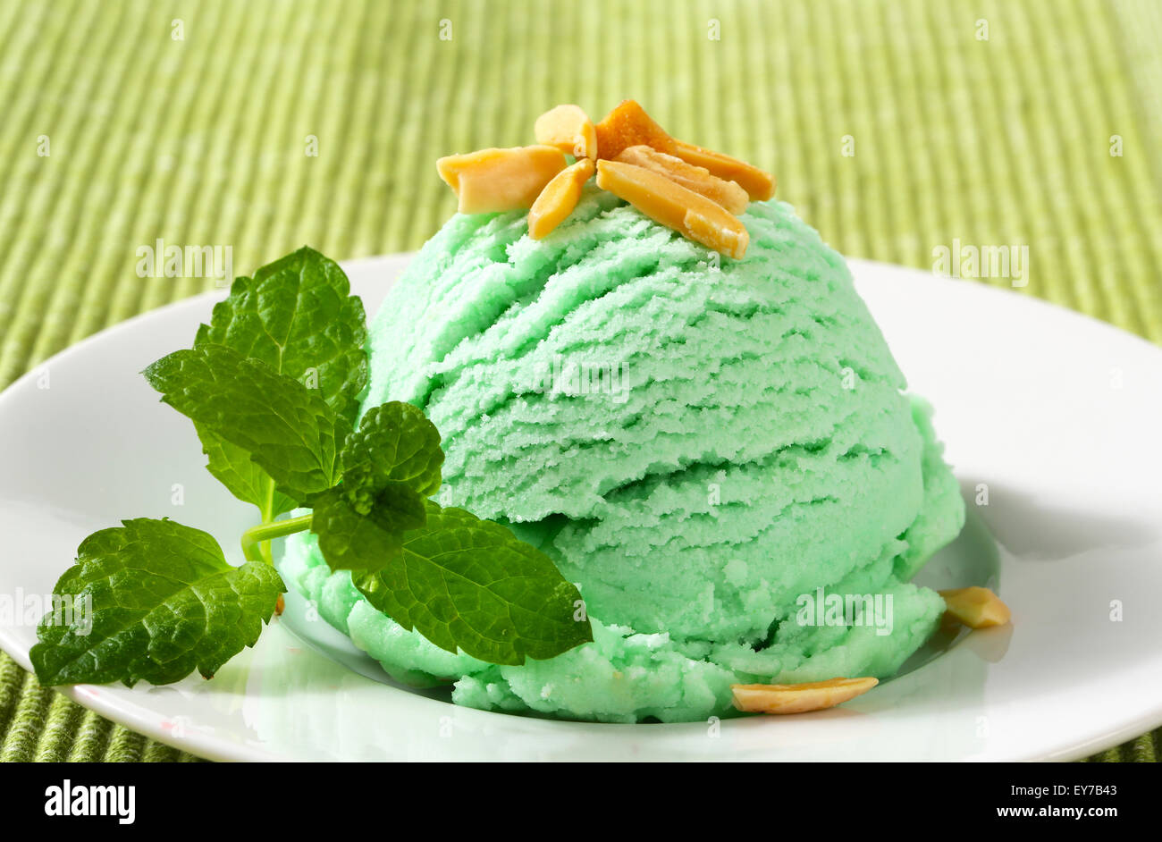 Scoop of green ice cream on plate Stock Photo - Alamy
