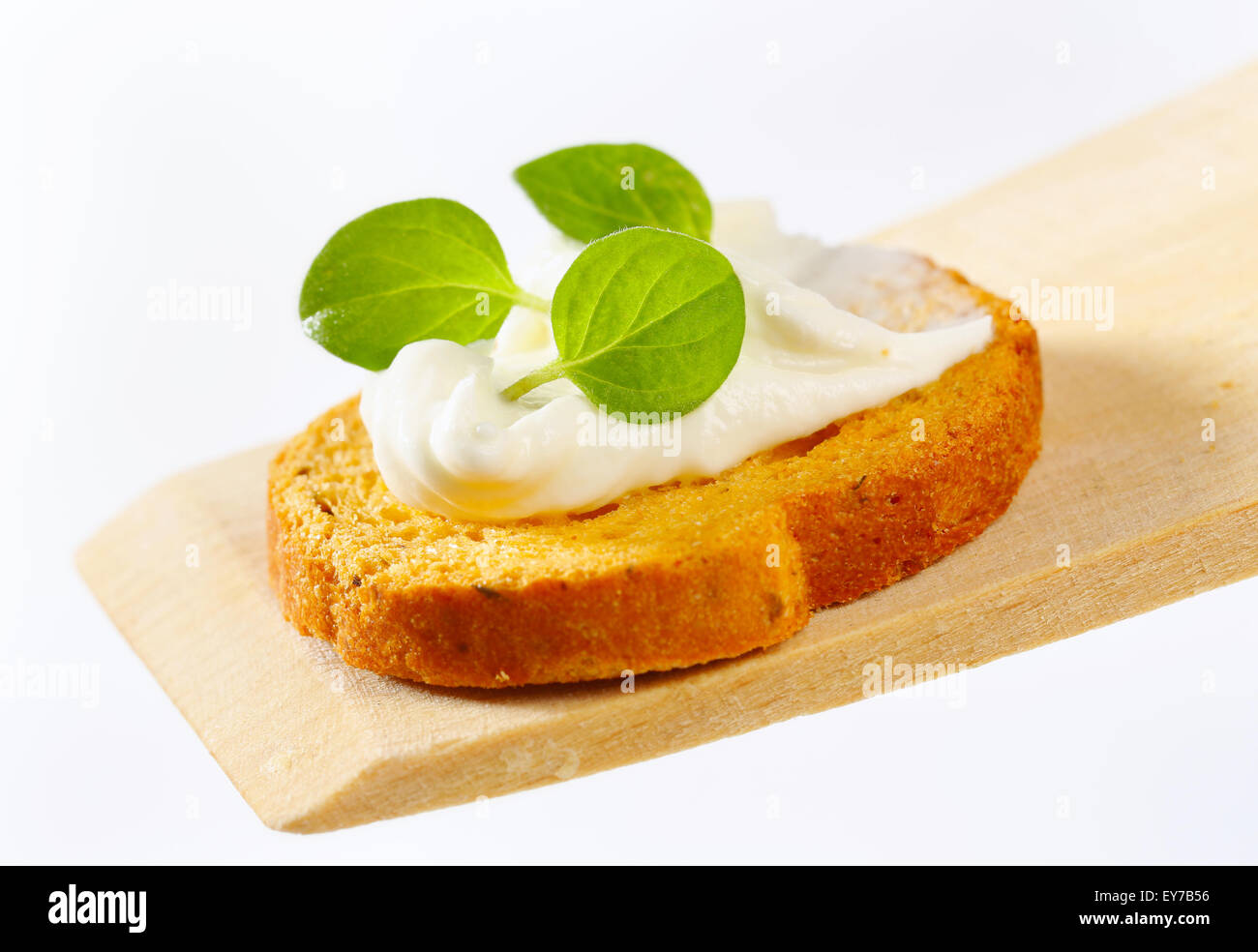 Small round toast with cheese spread Stock Photo - Alamy