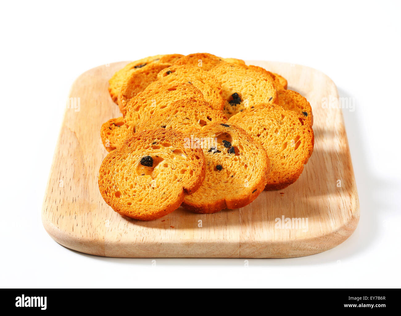 Small round toasts with black olives Stock Photo - Alamy