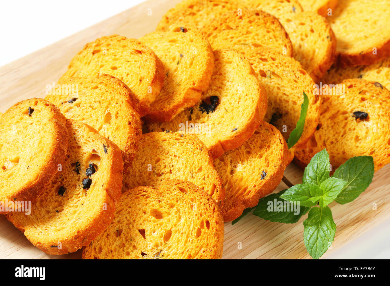Small round toasts with black olives Stock Photo - Alamy