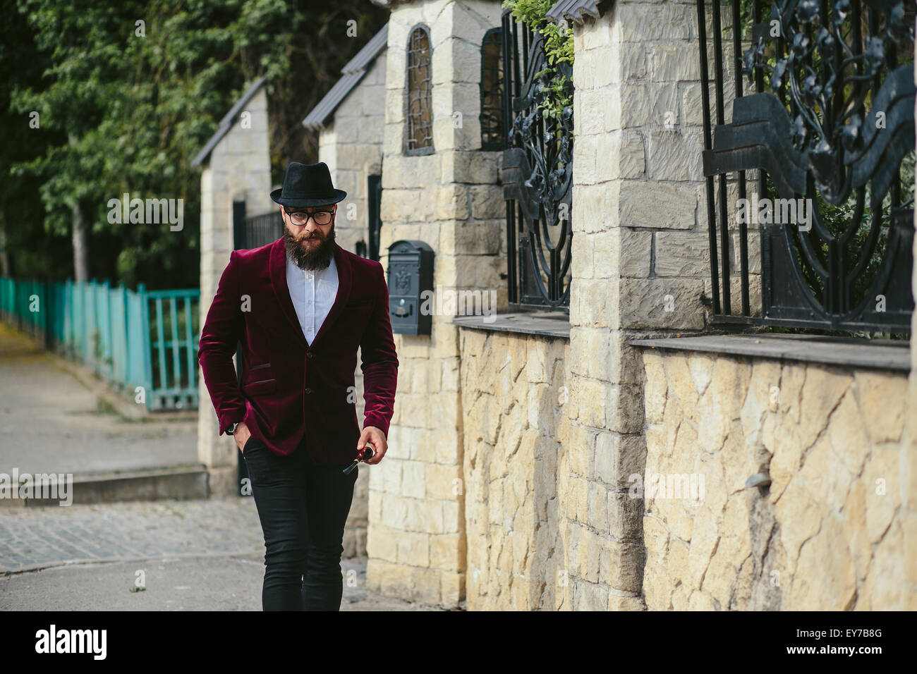 rich man with a beard walk on street Stock Photo - Alamy