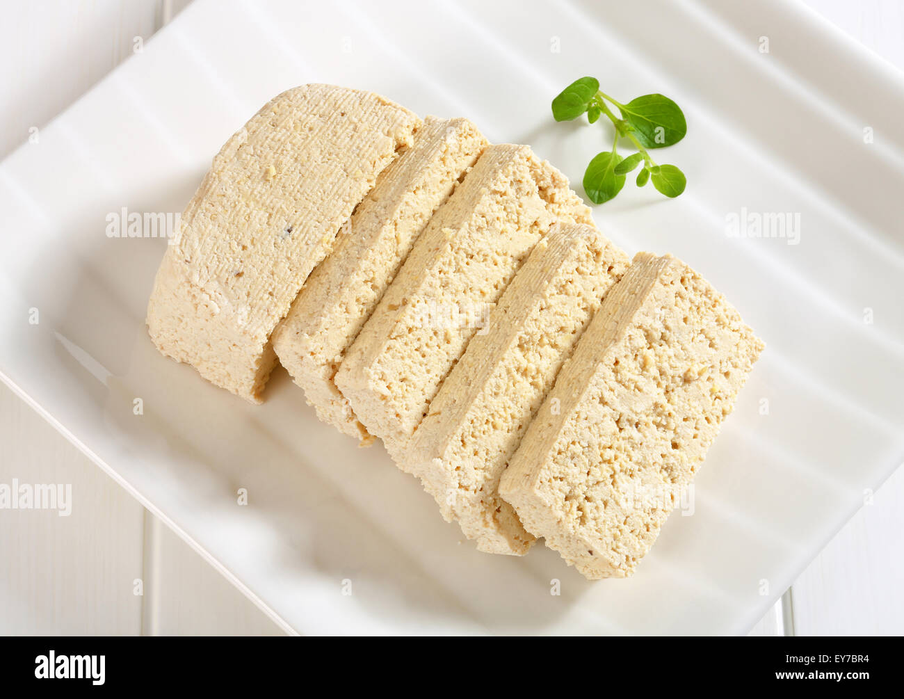 Slices of homemade tofu on plate Stock Photo - Alamy