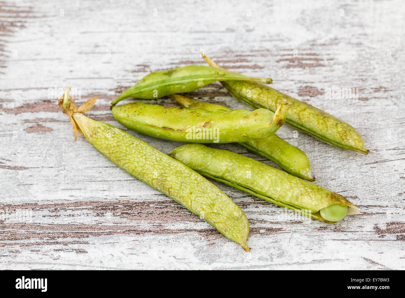 Fresh raw green pods on white wooden background Stock Photo - Alamy