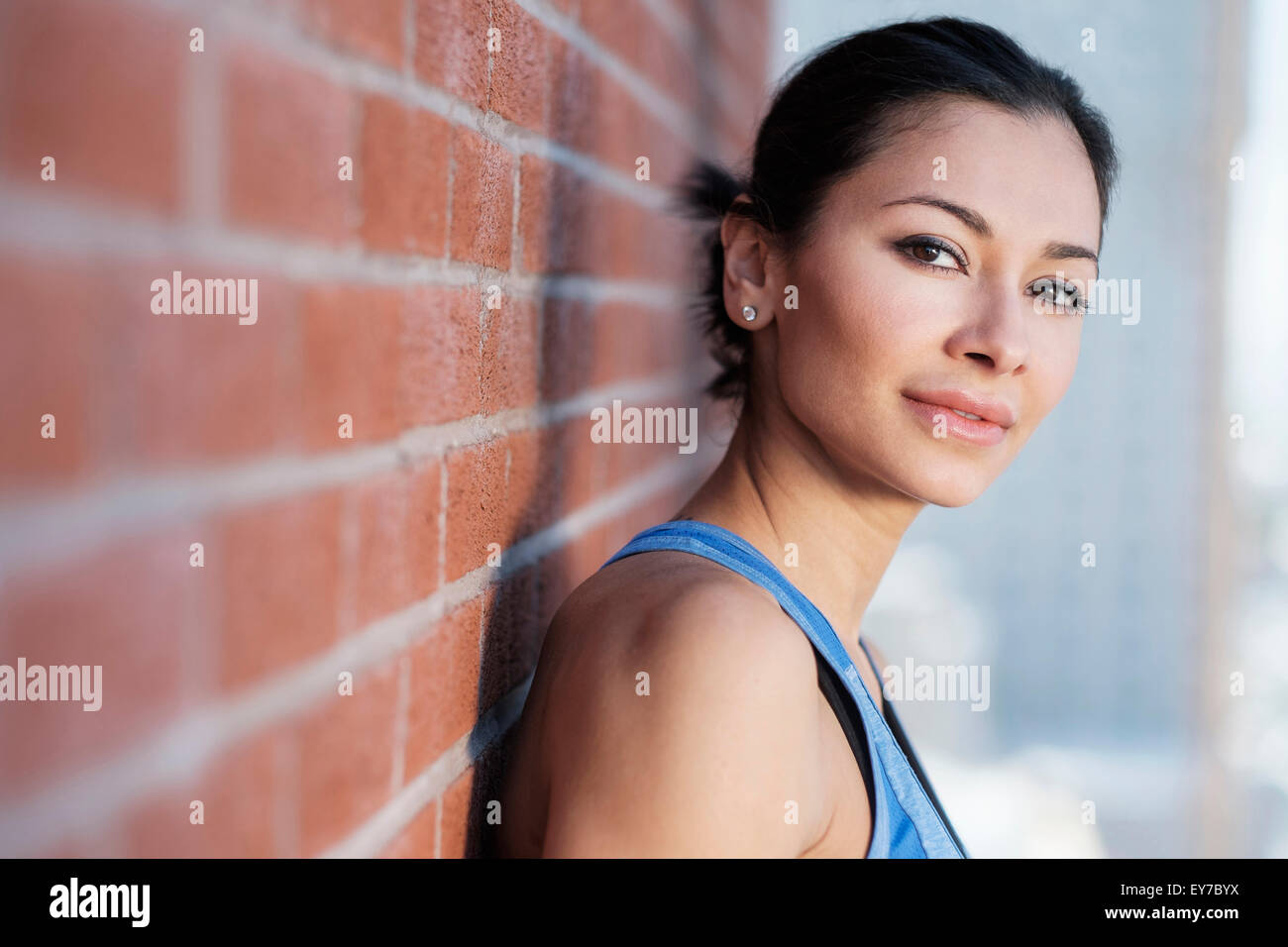 Lady by brick wall hi-res stock photography and images - Alamy