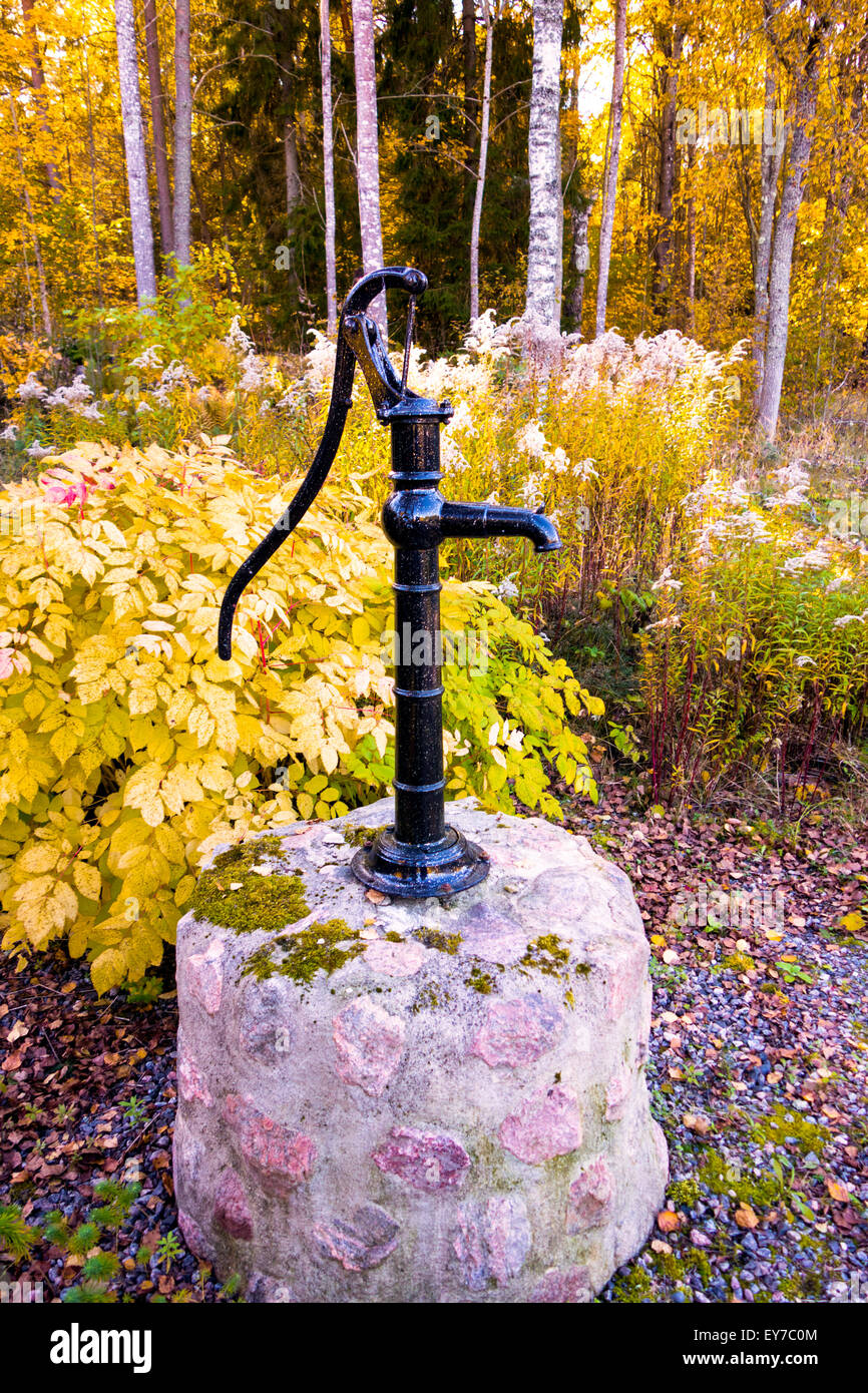 Water tap to an old well Stock Photo - Alamy
