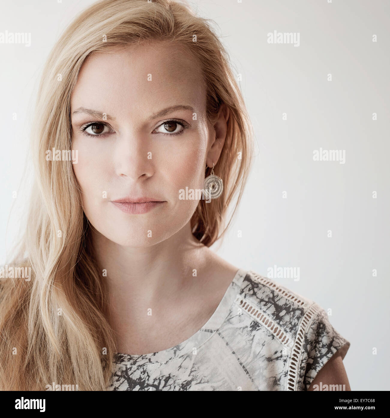 Portrait of mid-adult woman on white background Stock Photo - Alamy