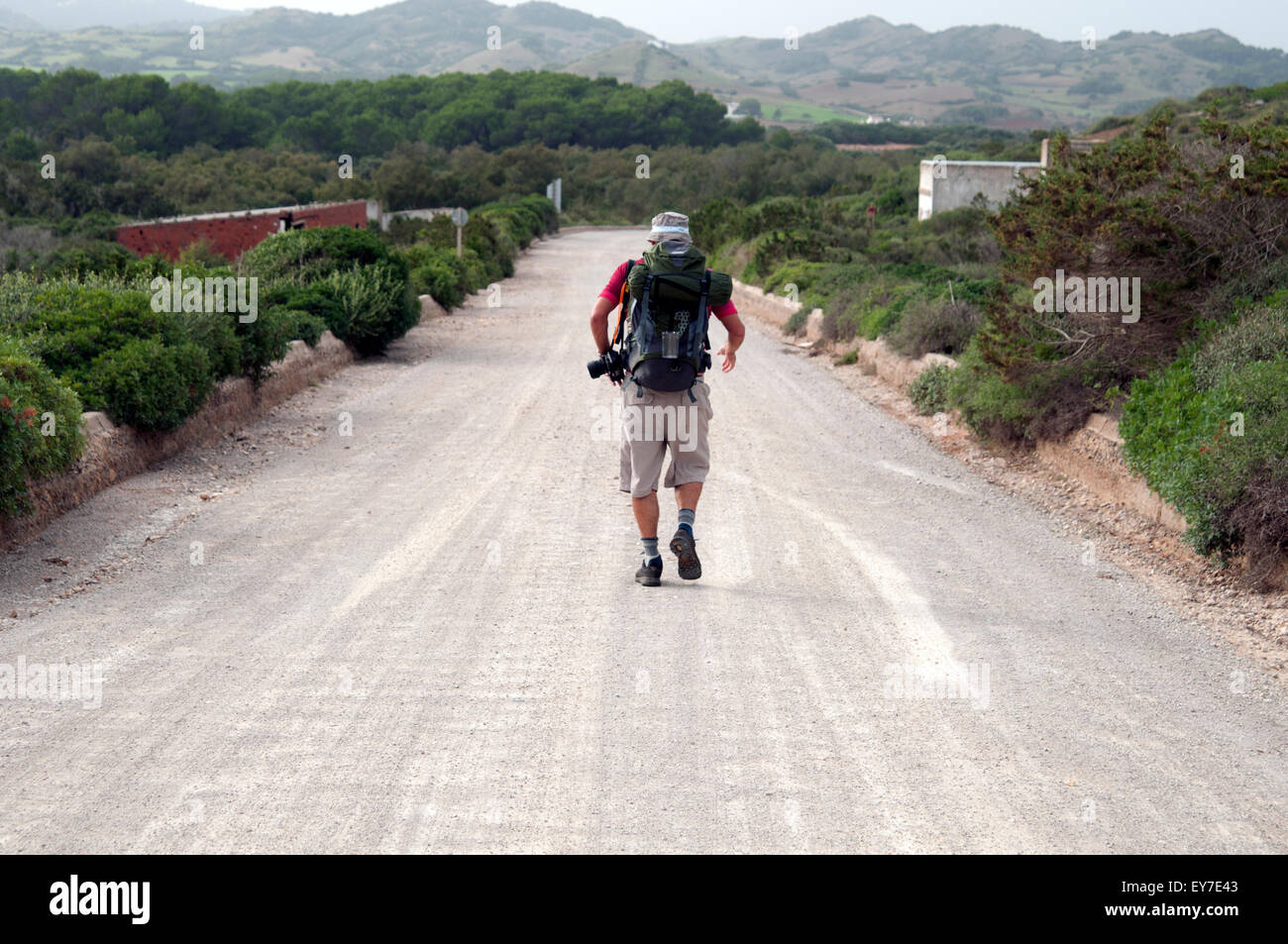 A hiker walks inland on the northern coastal path of the Cami de ...