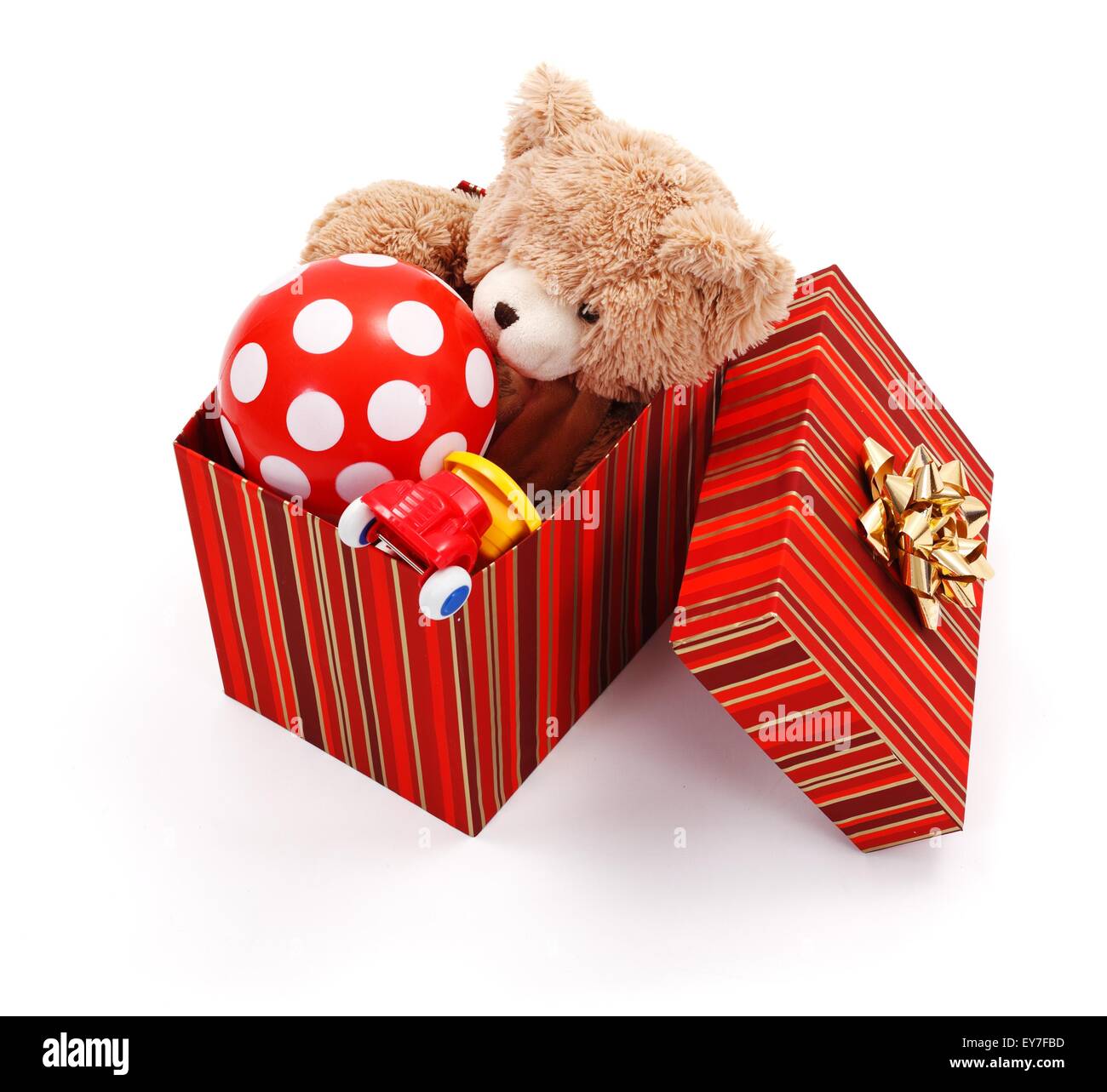 Big wrapped gift box full of various toys Stock Photo - Alamy