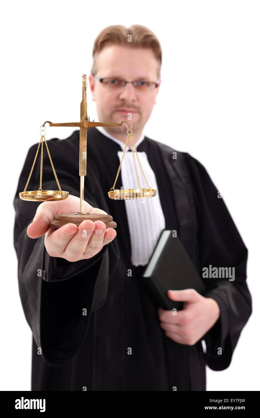 Serious judge showing little golden justice scale. Focus on scale Stock ...