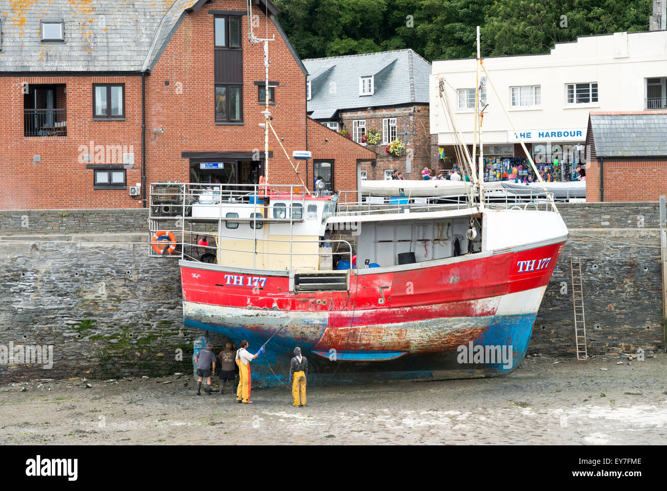 A fishing trawler in dry dock in Padstow harbour Cornwall UK being ...