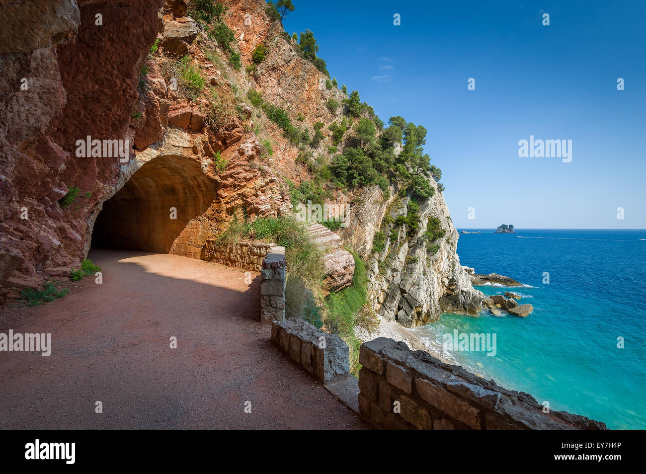 Pedestrian tunnel through the rocks Stock Photo - Alamy