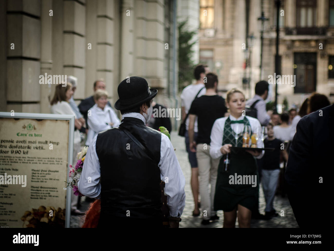 Bucharest streets Crowd enjoying a bustling street with a server ...