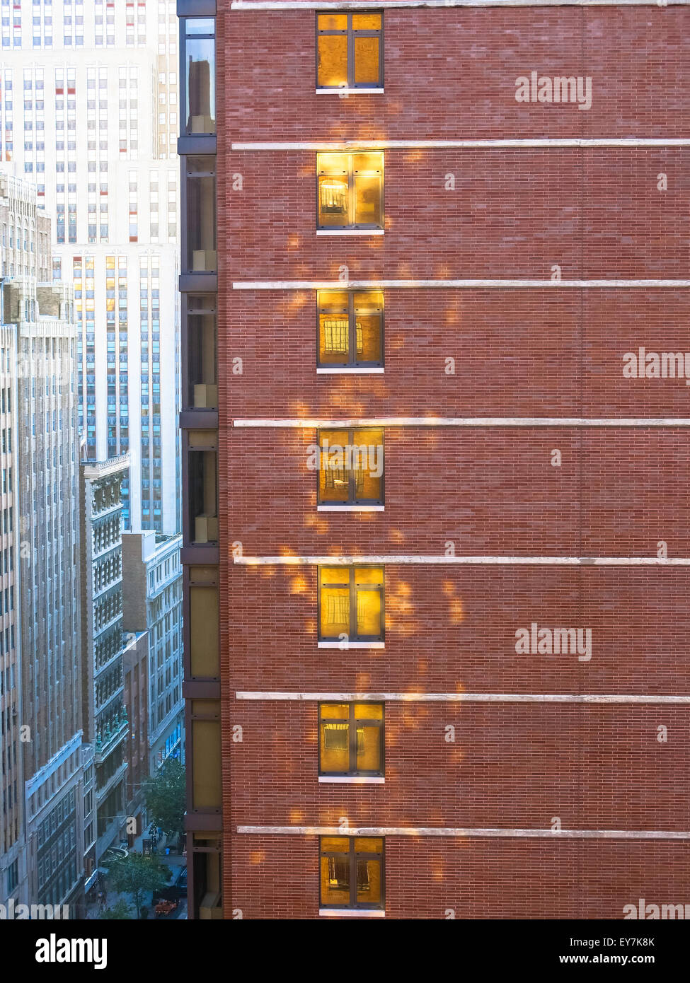 Reflected light on apartment house Windows Stock Photo - Alamy