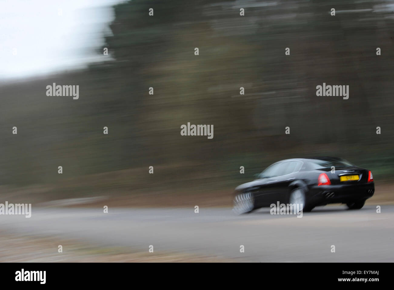 Speeding luxury car Stock Photo - Alamy