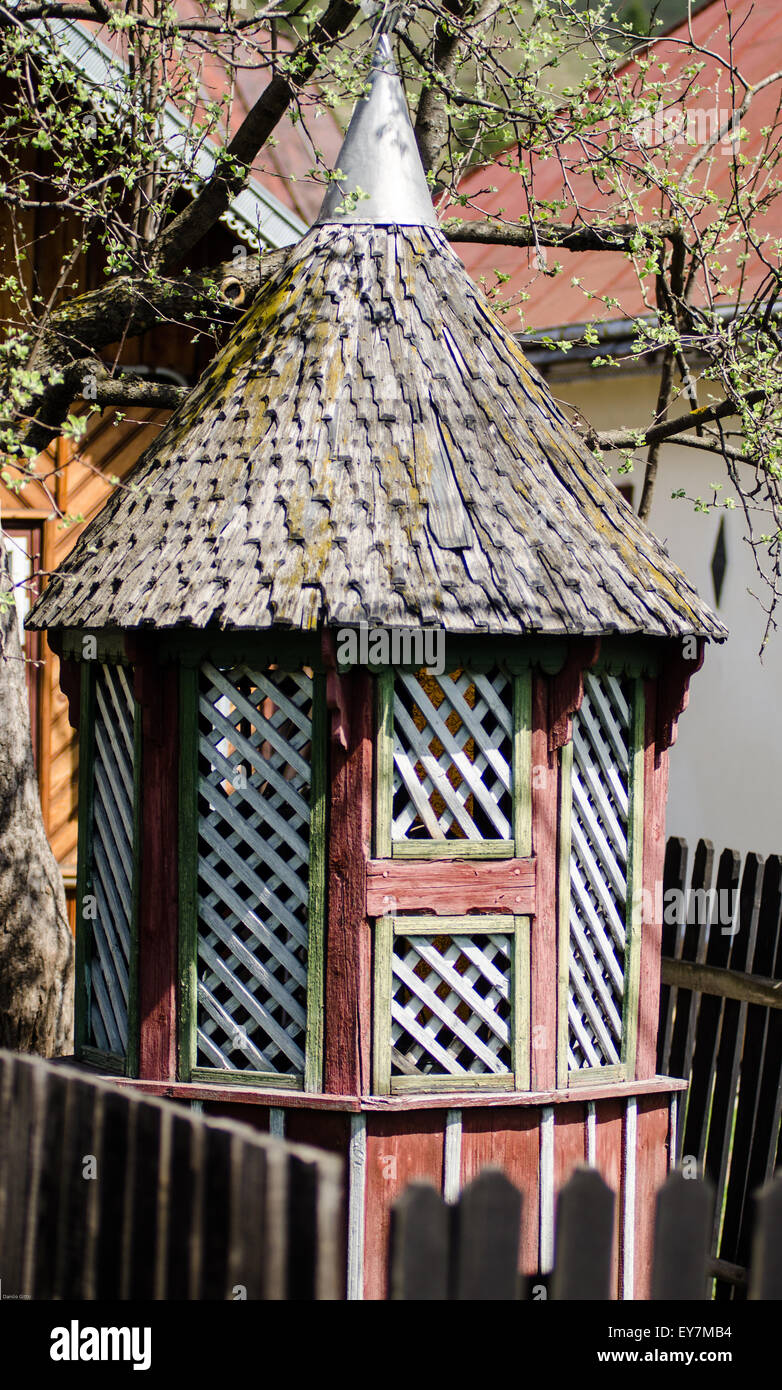 Countryside House Rustic wooden well beside traditional house in a ...