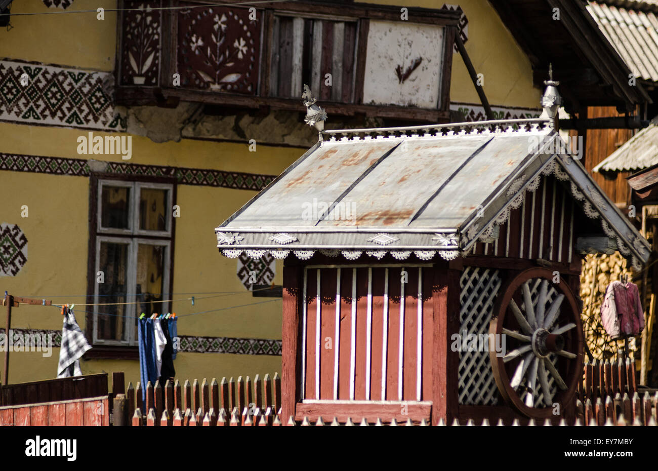 Countryside House Rustic wooden well beside traditional house in a ...