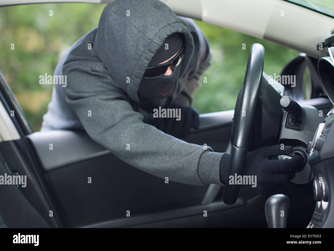 Burglar wearing mask balaclava, car burglary Stock Photo - Alamy