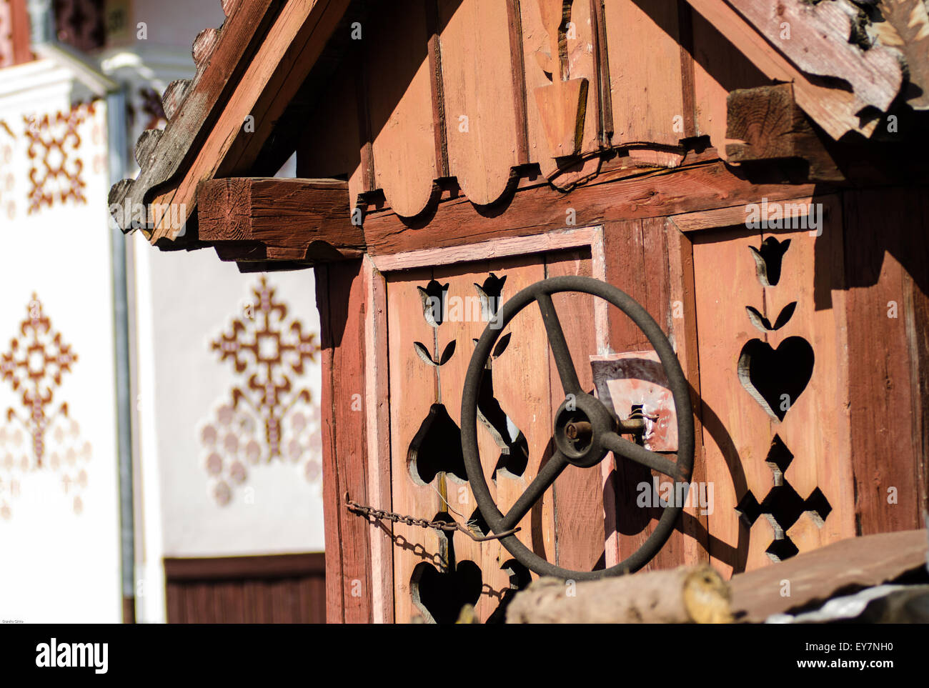 Countryside House Rustic wooden well beside traditional house in a ...