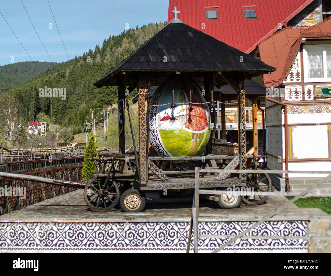 Easter Egg cart Giant decorative egg displayed on a wooden structure in ...