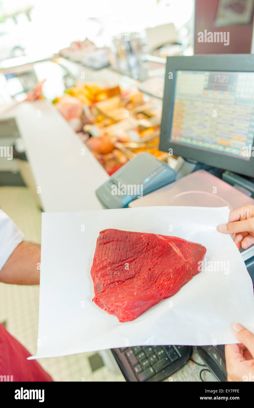 Buying beef from the butcher Stock Photo - Alamy