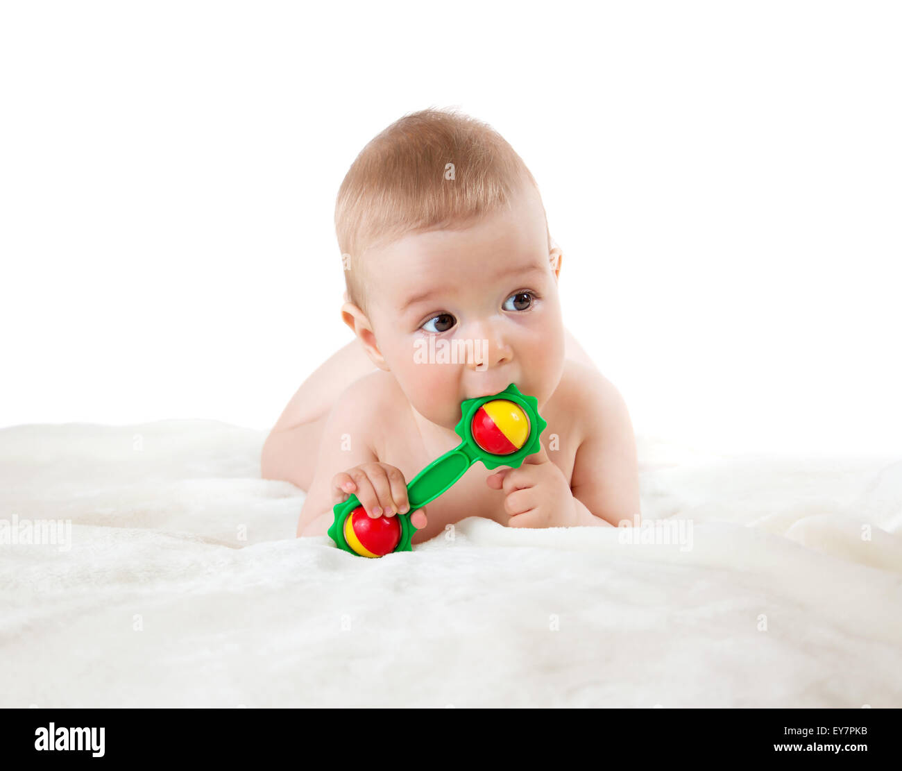 Baby holding a toy Stock Photo - Alamy