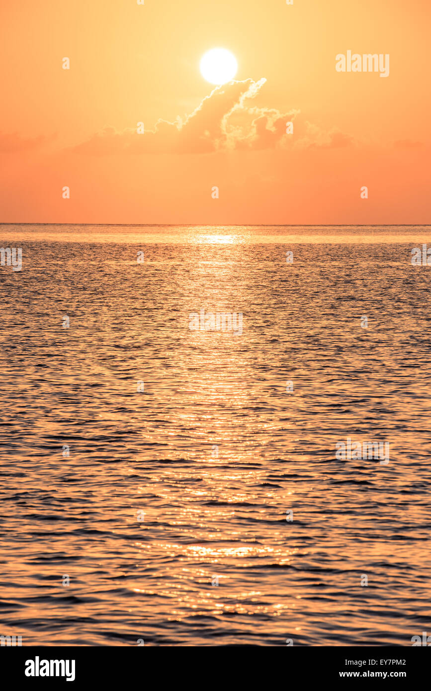 Beautiful tropical sunset ocean background. Vertical shot Stock Photo ...