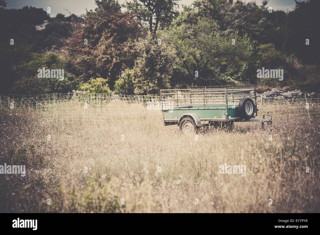 Old cargo trailer in a rural place. Vintage filtered shot Stock Photo ...