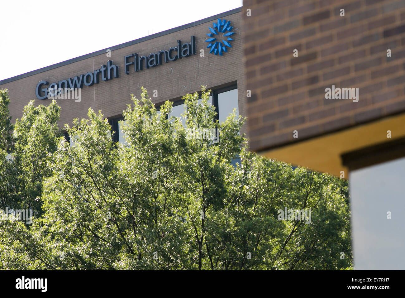 A logo sign outside of the headquarters of Genworth Financial in ...