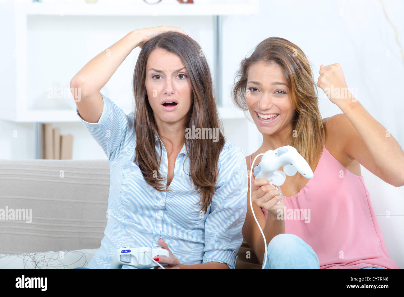 Friends playing computer game Stock Photo - Alamy