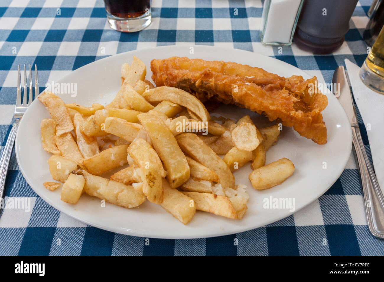 Plate of fish and chips on a restaurant table Stock Photo - Alamy
