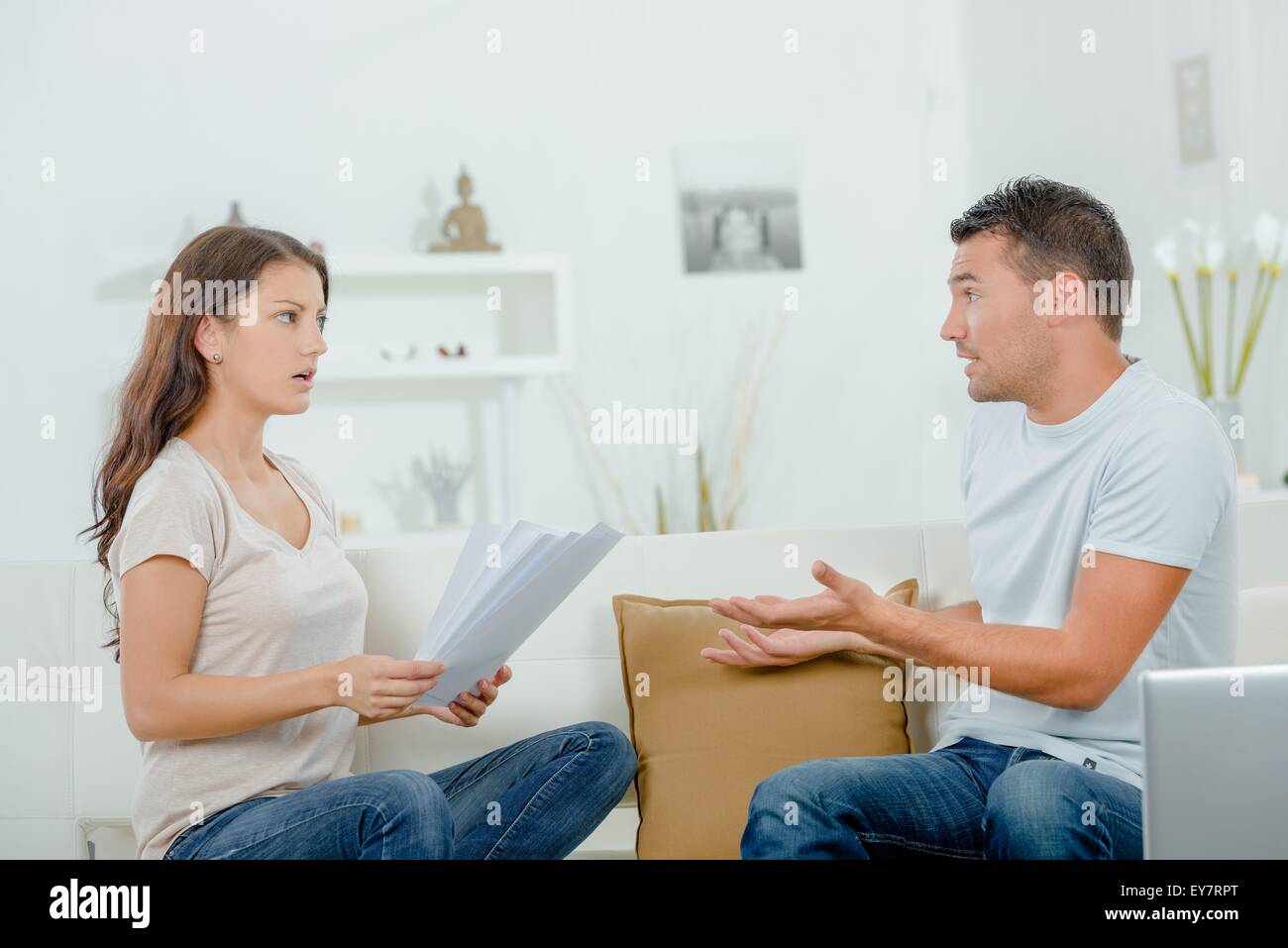 Couple arguing over bills Stock Photo - Alamy